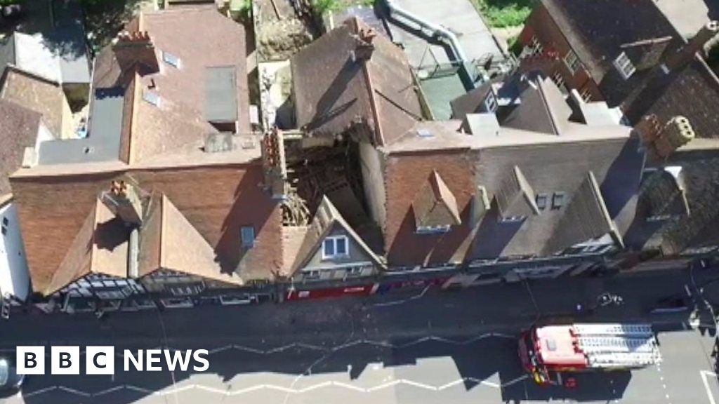 Firefighters' drone footage shows Bushey roof collapse - BBC News