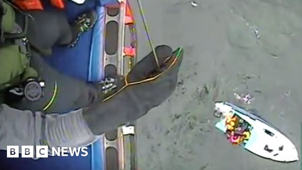 Men rescued from sinking boat off the Ayrshire coast - BBC News