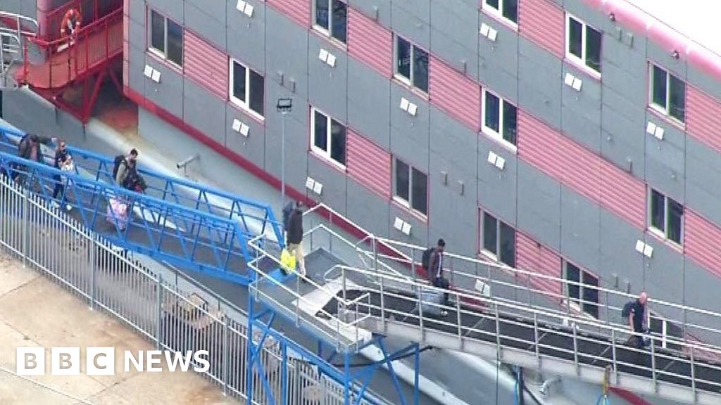 Bibby Stockholm: Boarding begins on the barge - BBC News