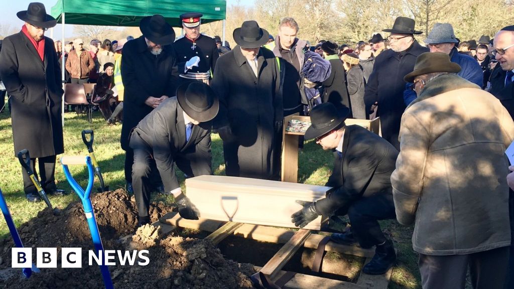 Holocaust victims funeral a reminder to 'confront racism'