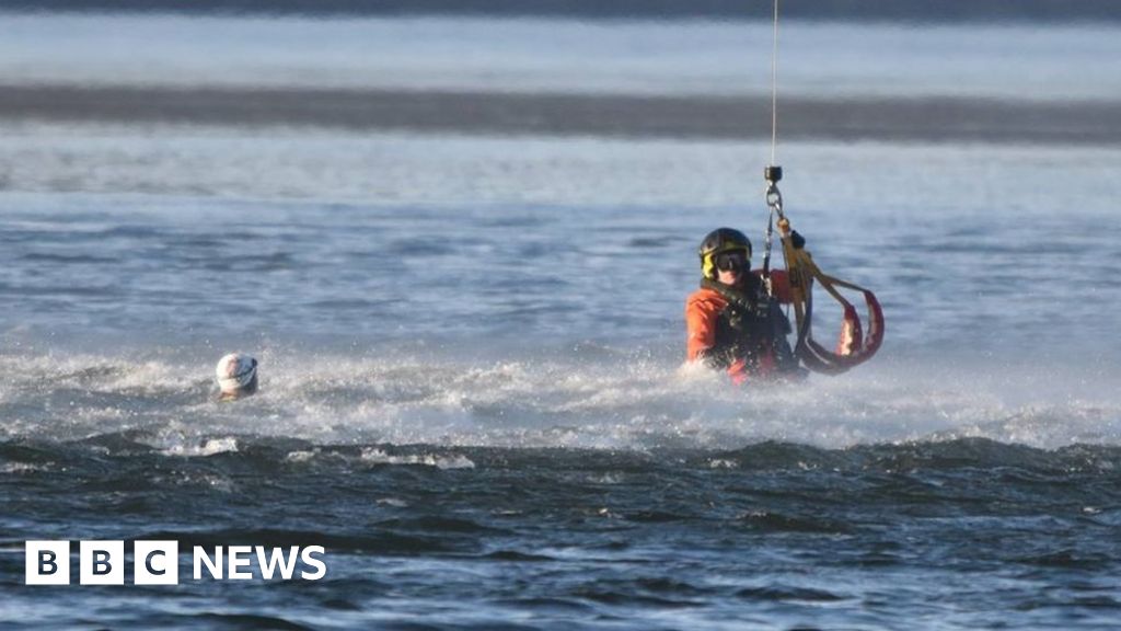 Open water swimmer tells coastguard winchman: 'I'm okay'