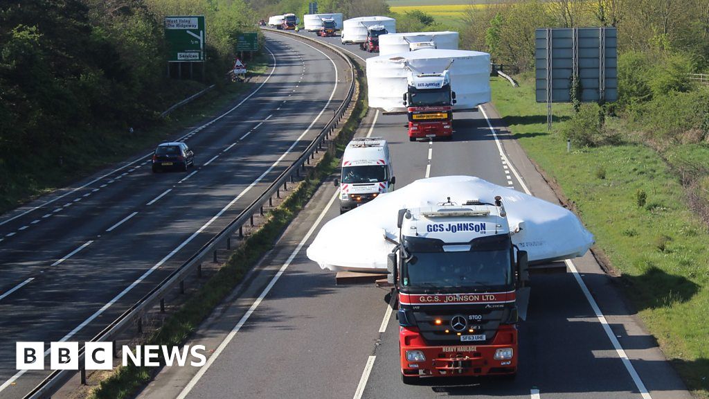 Road convoy moves giant space chamber