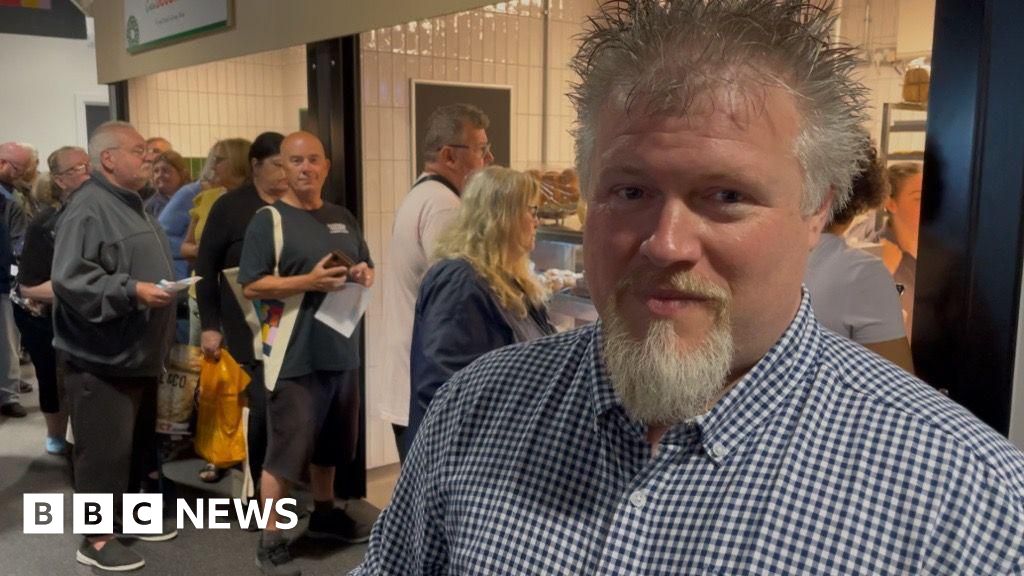 Legendary West Bromwich bakery Firkins returns with huge queue - BBC News