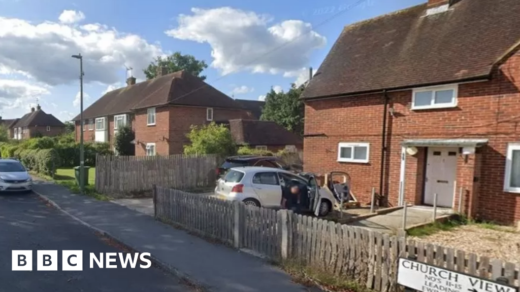 Ash murder: Woman charged after woman in her 50s found dead - BBC News
