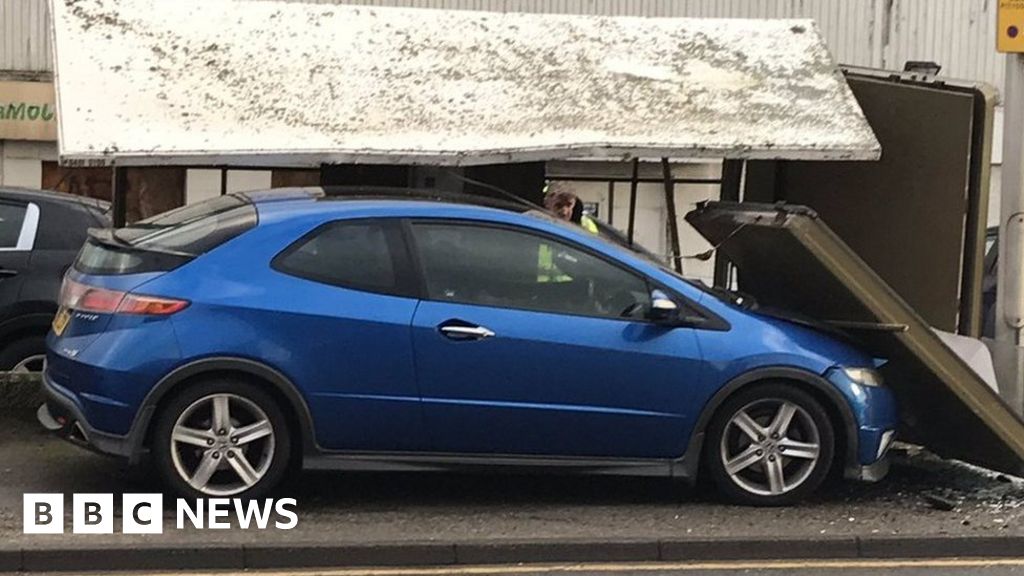 Car crashes into bus stop outside Pittodrie football stadium - BBC News
