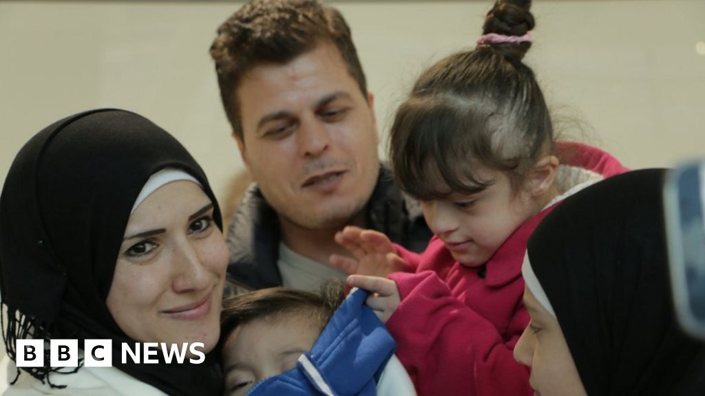 Syrian refugee baby reunited with Cardiff family - BBC News