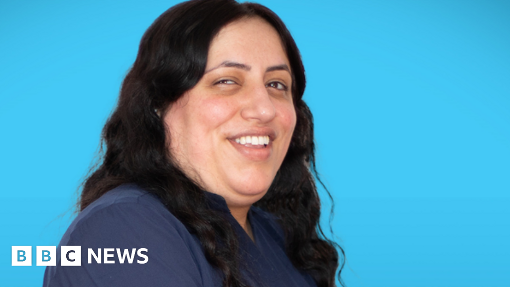 Blind police accountant who is 'real role model' becomes MBE - BBC News