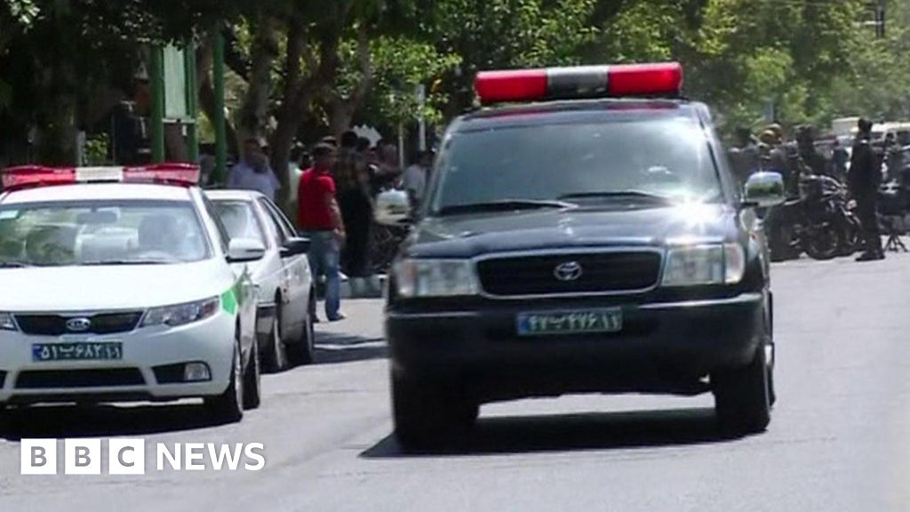 Security and ambulances at Iran's parliament - BBC News