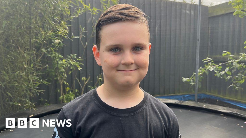 Boy with amputated limbs treated to garden makeover - BBC News