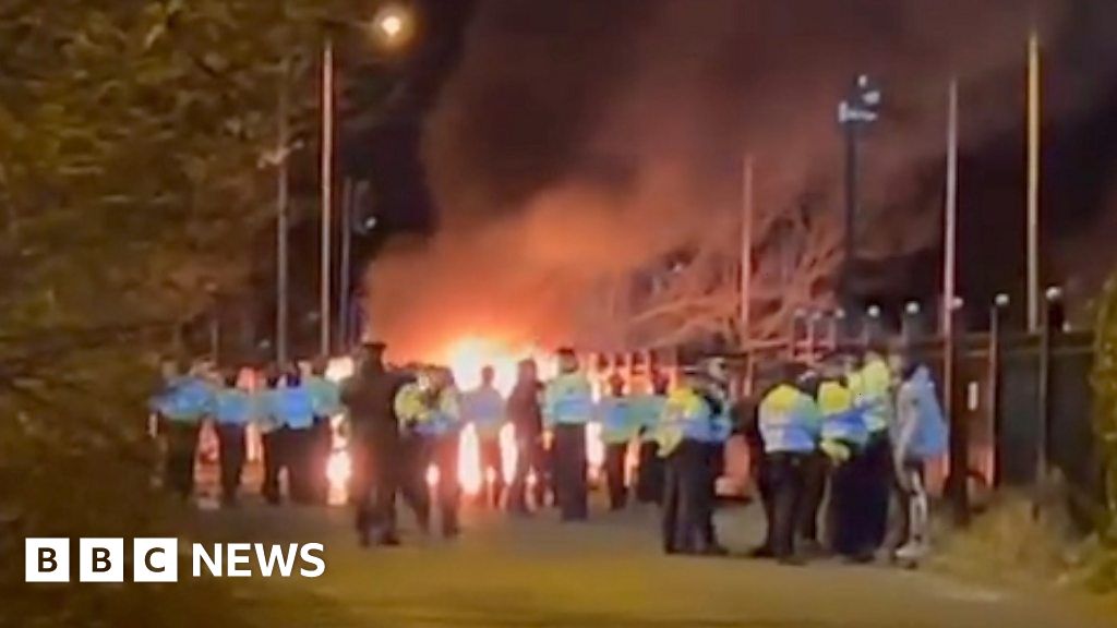 Police van set on fire outside asylum seeker hotel