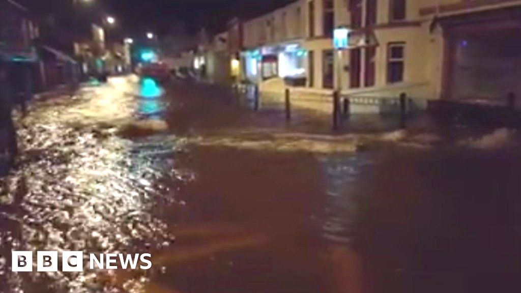 Flooding: River bank bursts in Anglesey town - BBC News