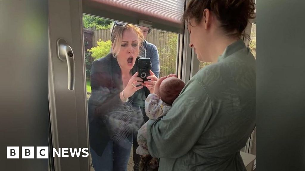 Liverpool gran's lockdown baby meeting chosen for photo archive - BBC News