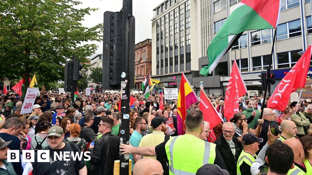 In pictures: protesters and police at Belfast City Hall