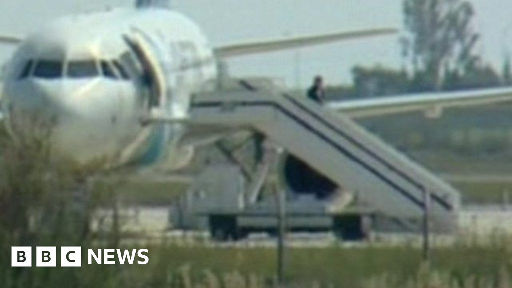 EgyptAir Flight MS181 hijacking suspect emerges from plane - BBC News
