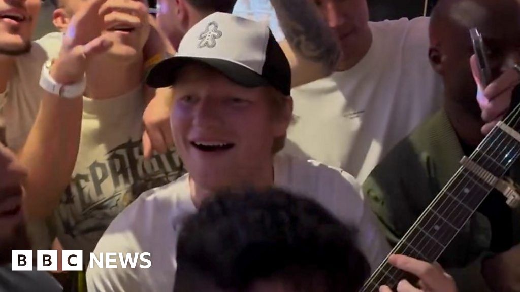 Ed Sheeran and Ipswich Town players celebrate promotion
