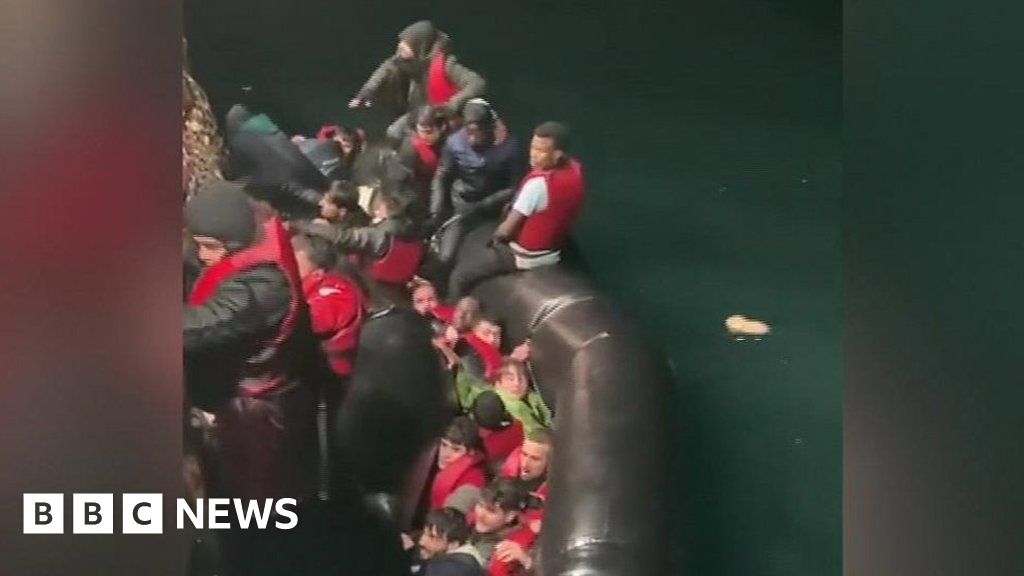 English Channel: Footage of migrants rescued from sinking boat - BBC News