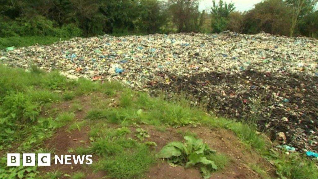 Landowner told to move 'disgusting' rubbish - BBC News