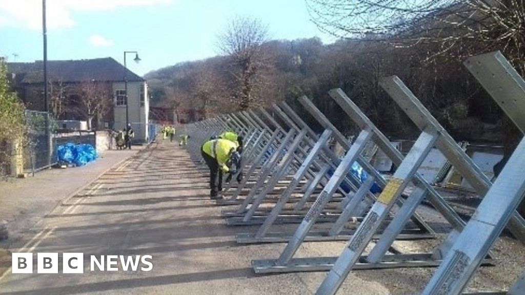 Flood barriers come down as River Severn levels fall