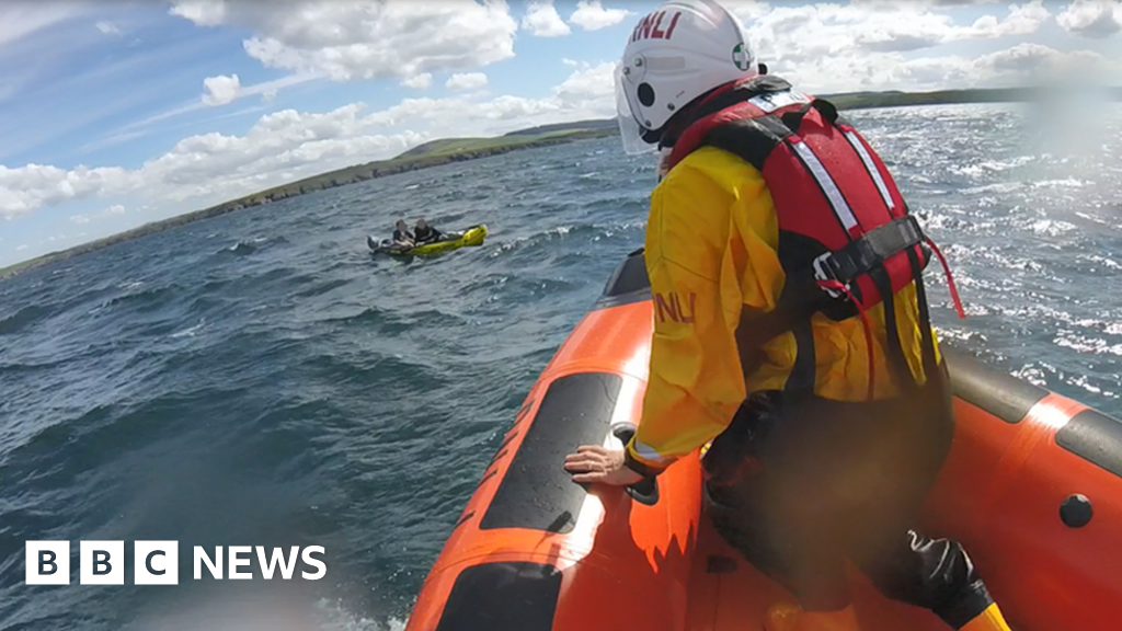 Teenage kayakers rescued after drifting out to sea - BBC News