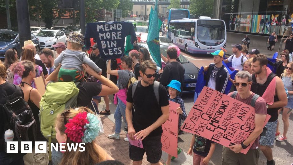 Bristol climate activists block traffic over consumerism - BBC News