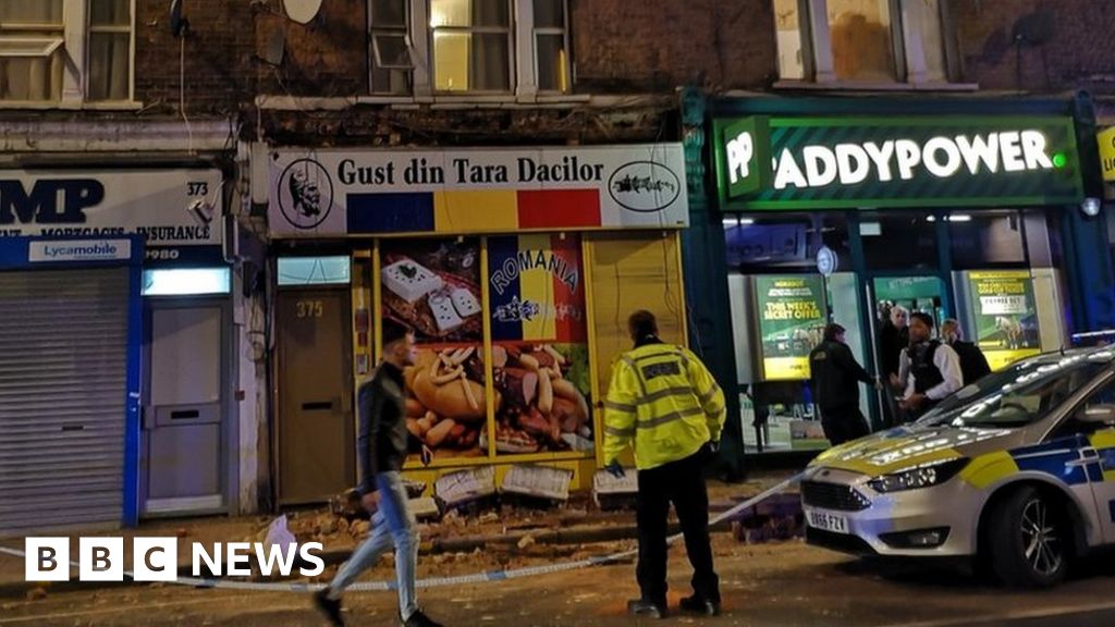 Woman hurt by collapsing shopfront in east London