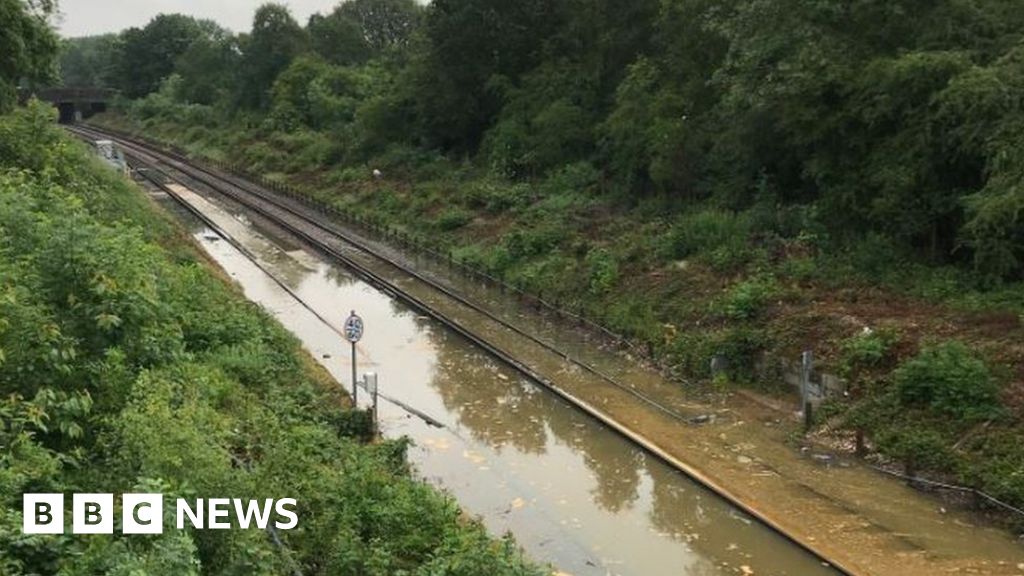 UK weather: Heavy rain causes road and rail disruption - BBC News