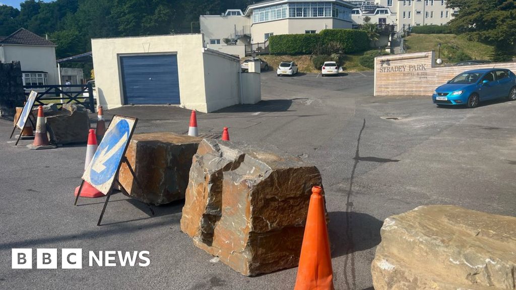 Llanelli: Boulders at asylum row Stradey Park Hotel entrance - BBC News