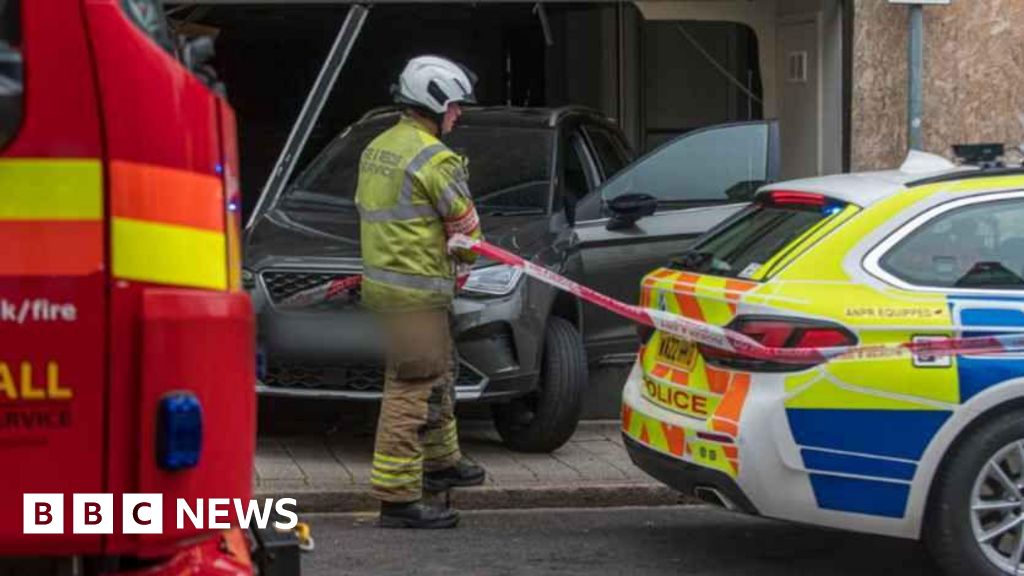 Driver injured after crashing into building