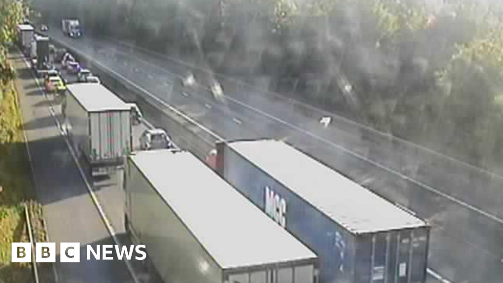 Fatal M11 crash between Stansted and Harlow sees man arrested - BBC News