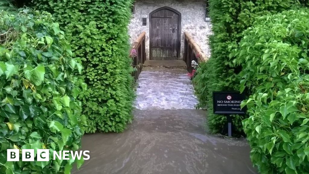 Two rescued from submerged car in 'significant' flooding in Kent - BBC News