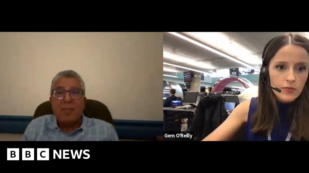 Explosions as surgeon stuck in Gaza interviewed - BBC News