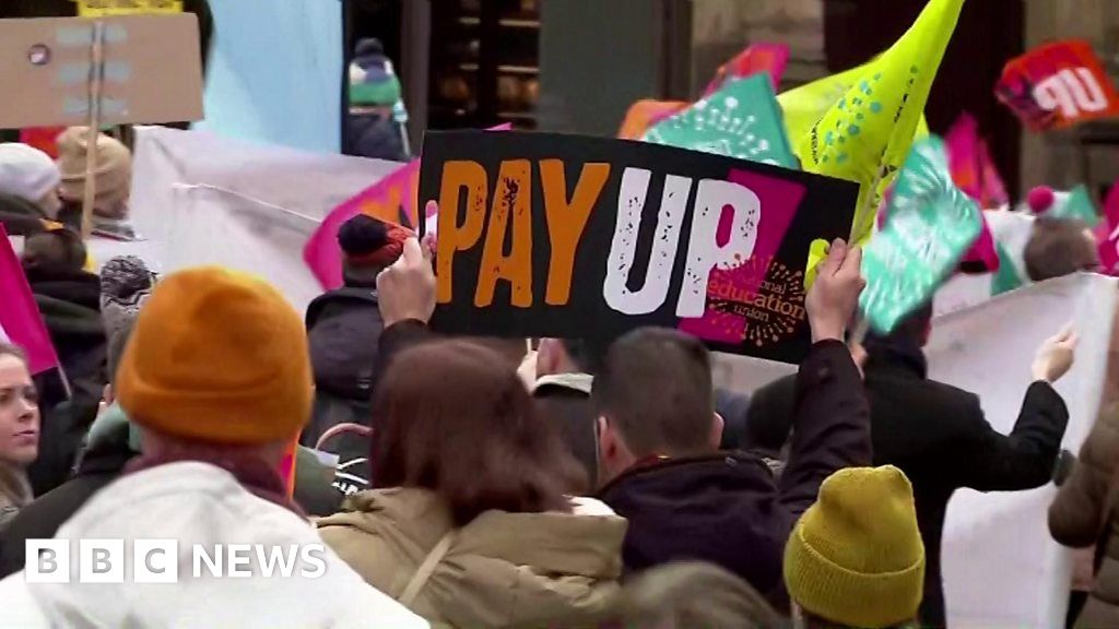 Striking teachers march through Leeds to protest over pay and conditions