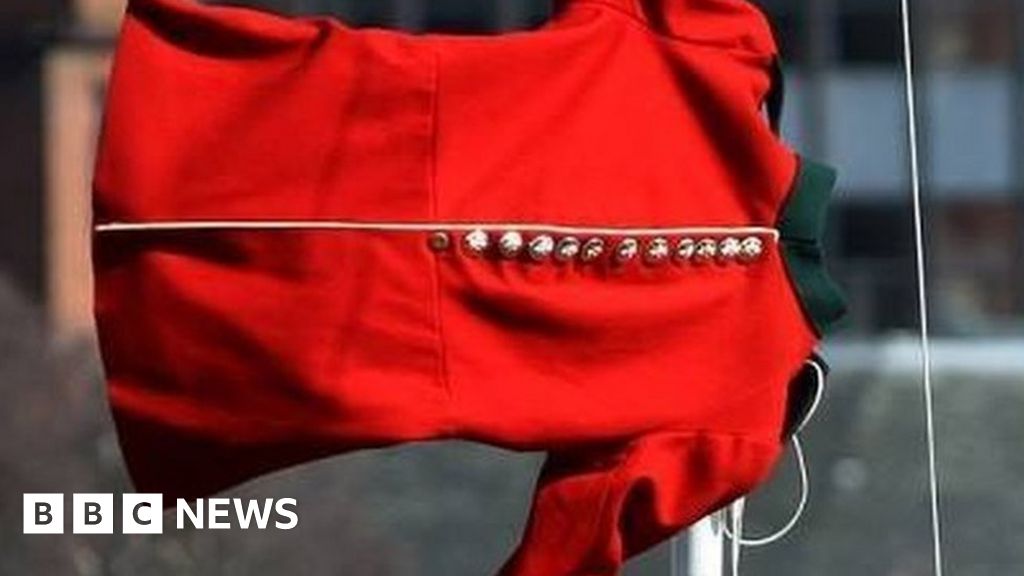 Red military jacket raised in Nottingham's Old Market Square - BBC News