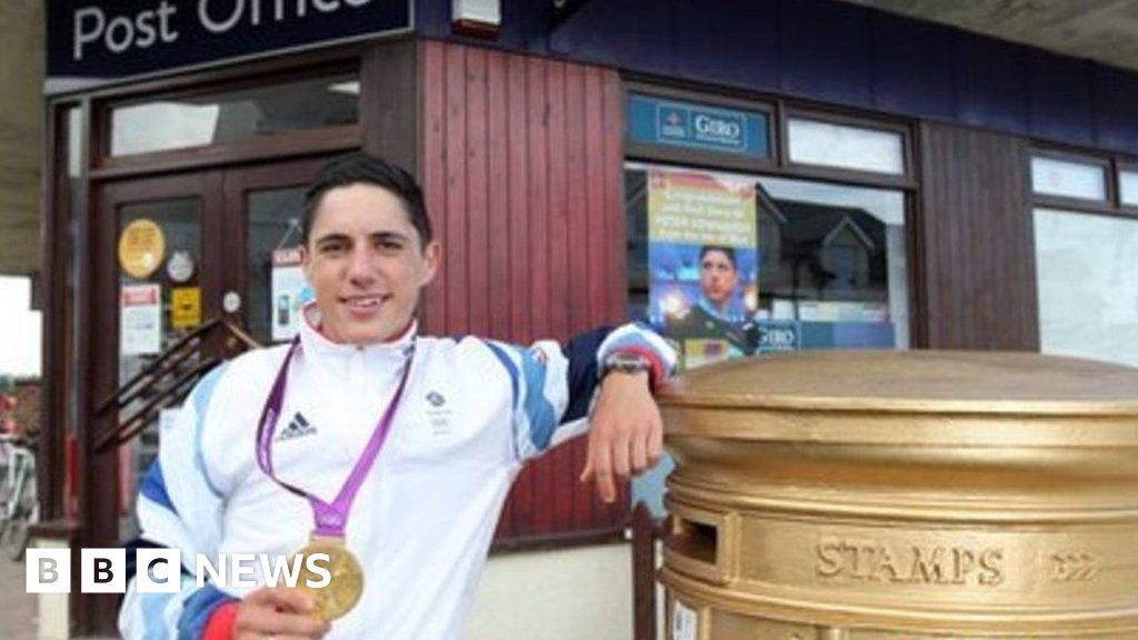U-turn over repainting of Olympian's gold post box after outcry - BBC News