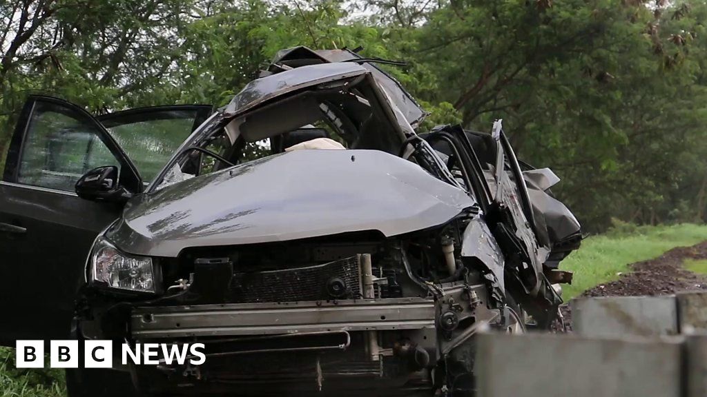 Crash investigator Ravishankar Rajaraman examines the wreckage of a ...