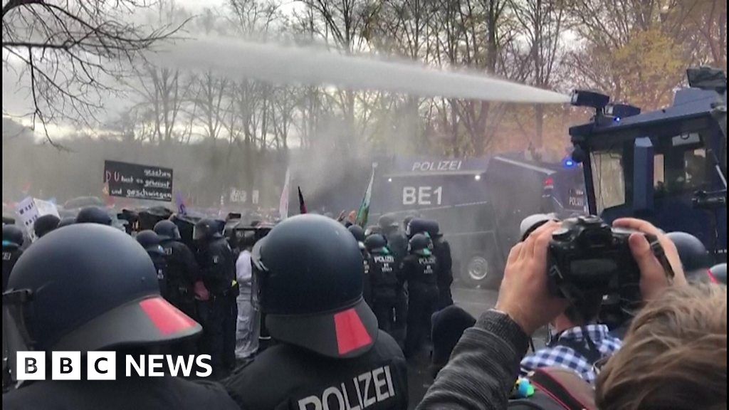Berlin police use water cannon to disperse Covid protest - BBC News