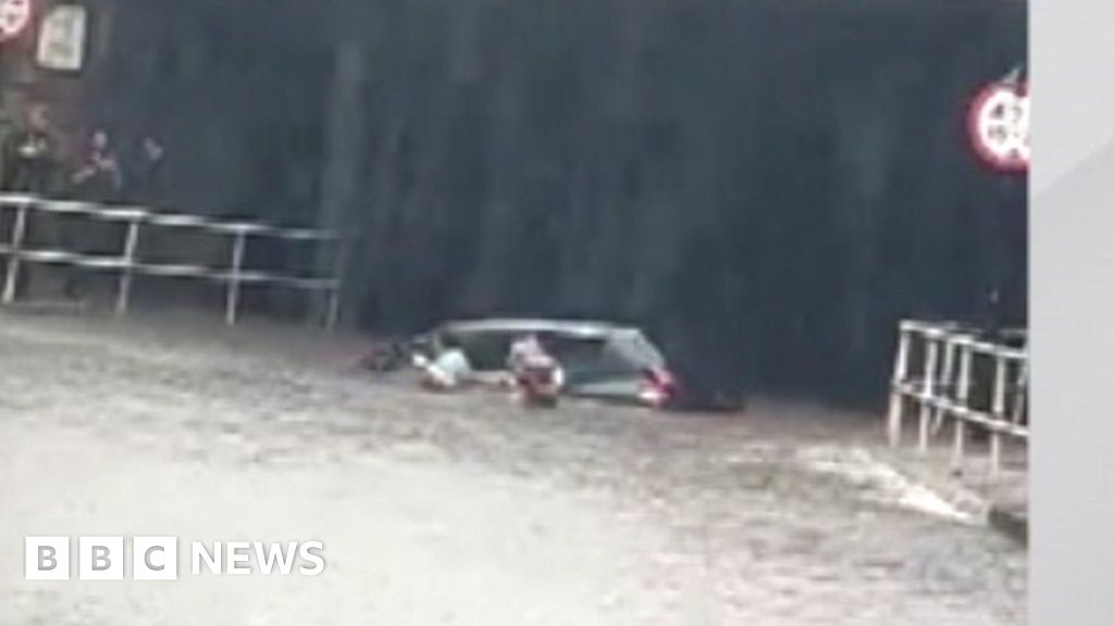 Sheffield floods: Passer-by pulls woman from partly submerged car - BBC ...