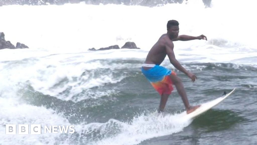 Teaching children to surf Liberia's wild waves - BBC News