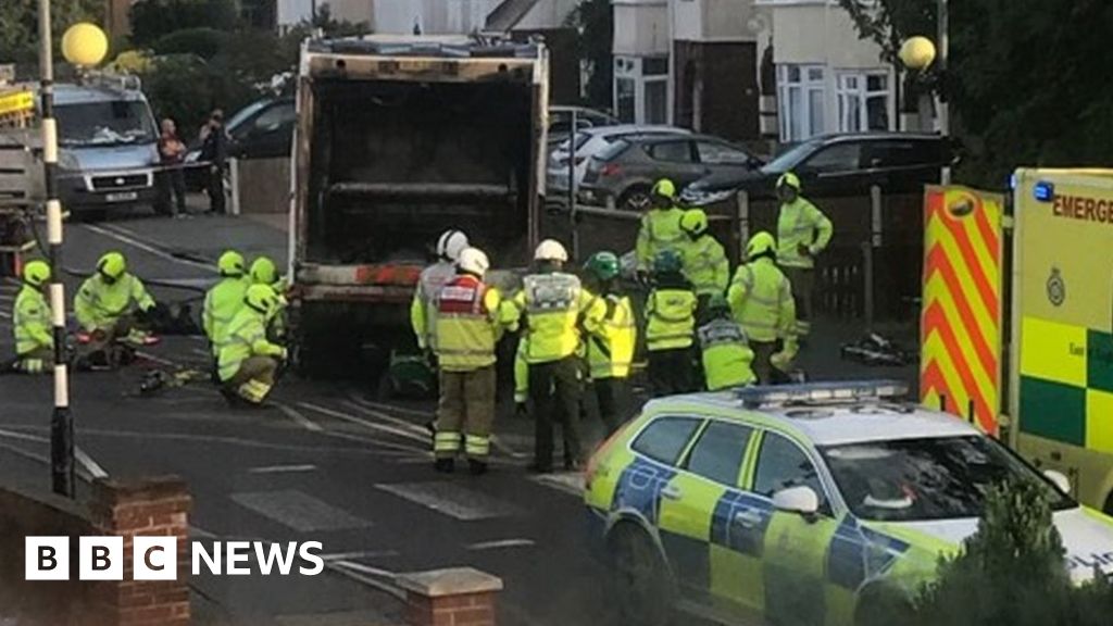 Motorcyclist trapped under bin lorry in Colchester - BBC News