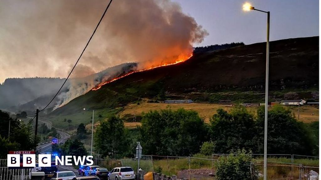 Helicopters help tackle fires at Maerdy and Cwm Rheidol - BBC News