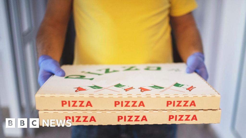 North Wales Police officers deliver pizza after seizing motorbike