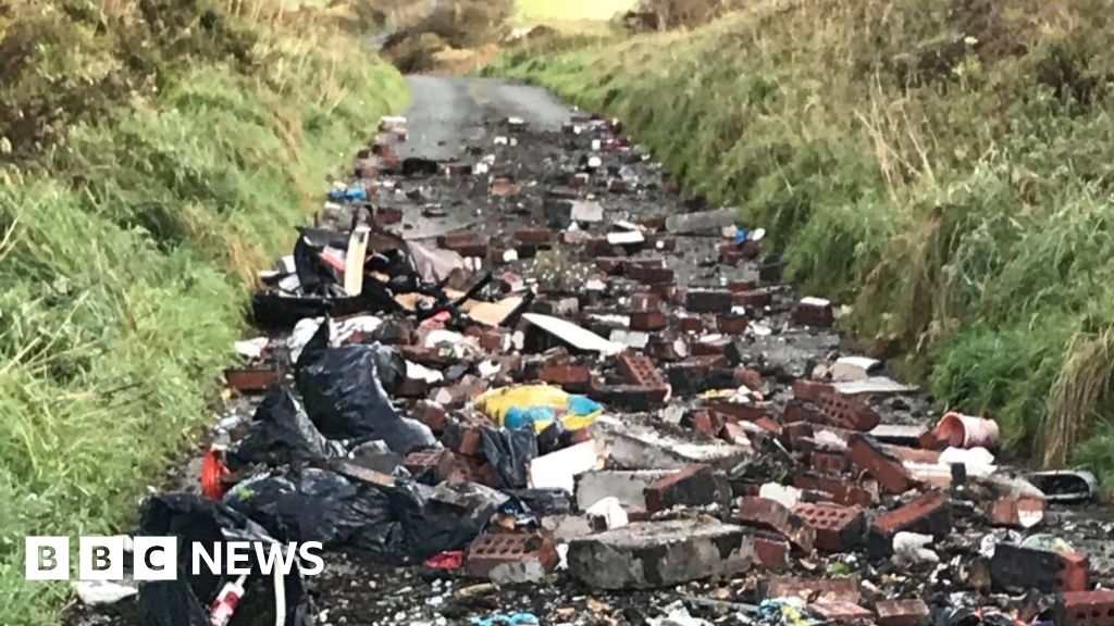 Fly-tipped rubble in Cornwall forces police to close road