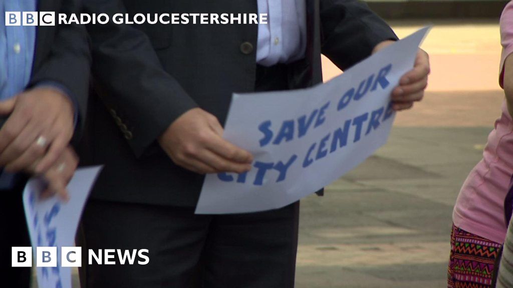 City centre protest over out-of-town shop in Gloucester - BBC News