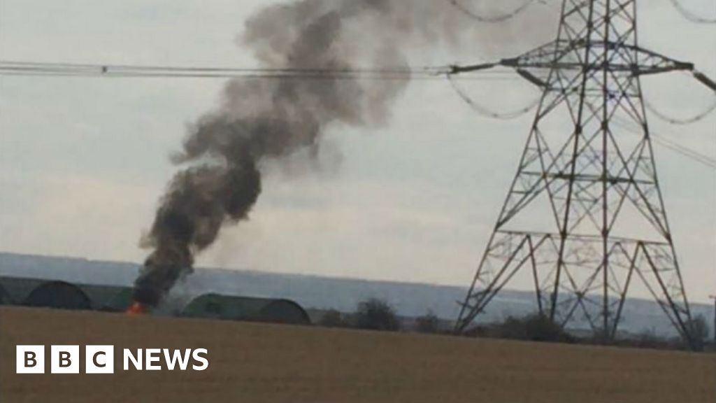 Microlight pilot crashes into pylon - BBC News