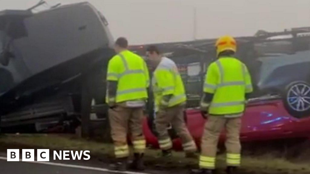 A15 Caenby Corner: Road closed after car transporter overturns - BBC News