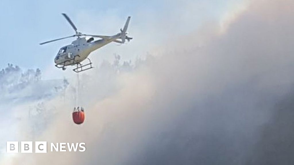 Fire near Aberystwyth continues to burn amid heatwave - BBC News