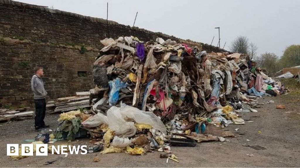 Fly-tippers dump 'colossal' rubbish heap at Blackburn firm - BBC News