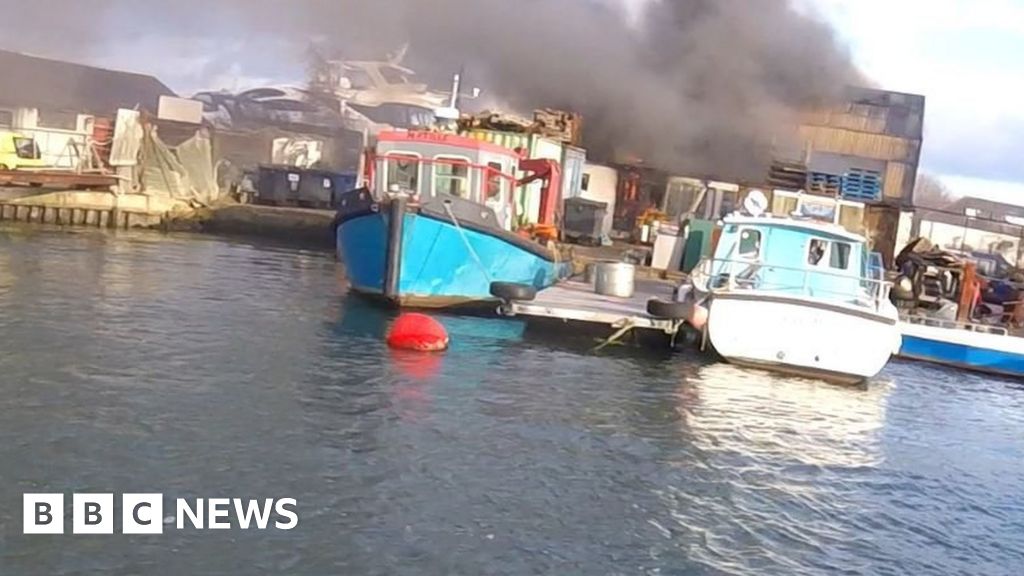 Seven rescued from Poole quayside workshop fire