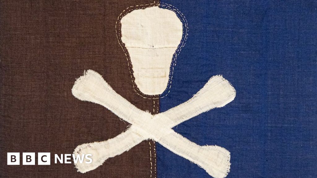 Portsmouth's Royal Navy Submarine Museum waves new Jolly Roger - BBC News