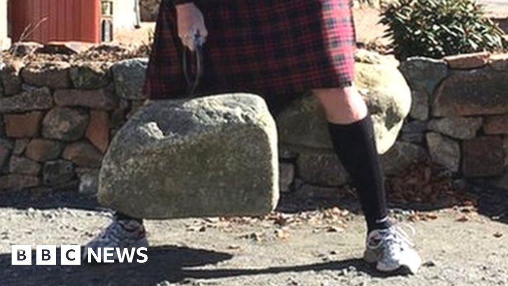 Tourist breaks famous Dinnie Stones lifting record at Potarch - BBC News